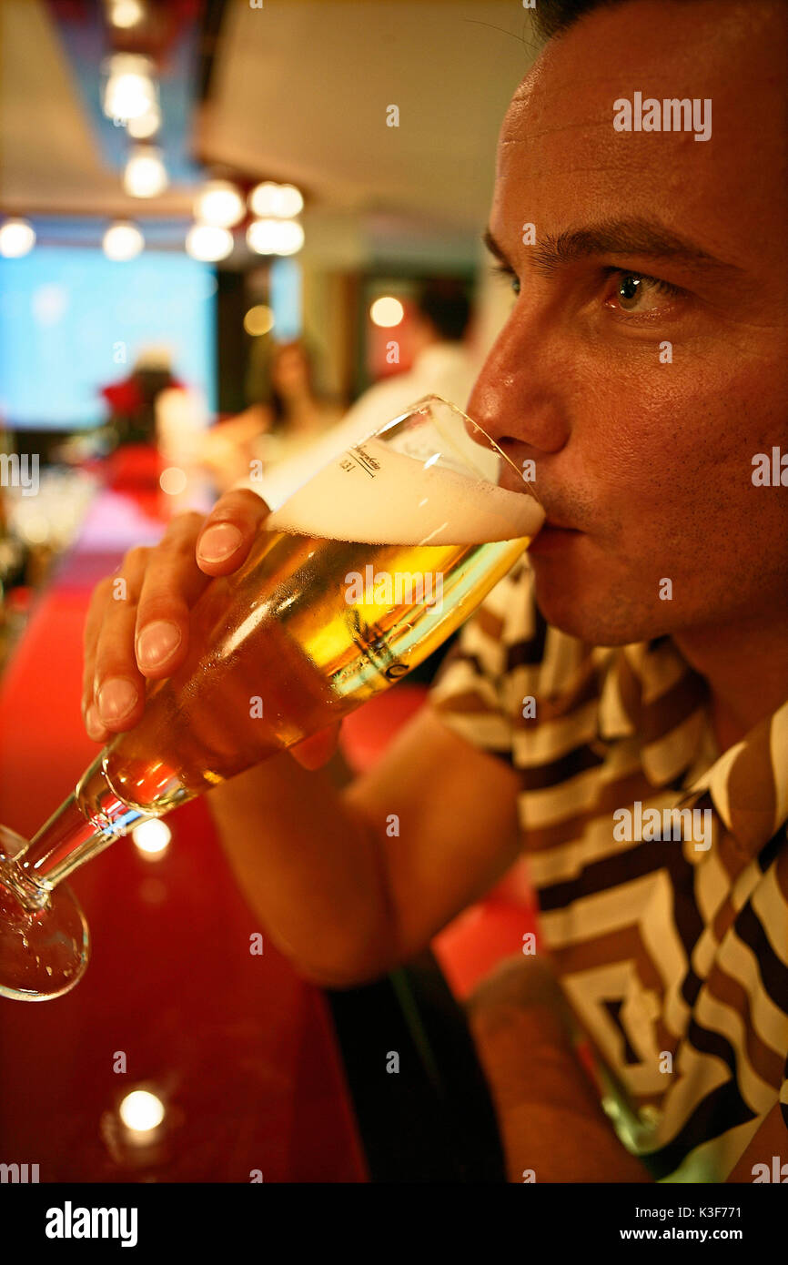 Young man drinks from hi-res stock photography and images - Alamy