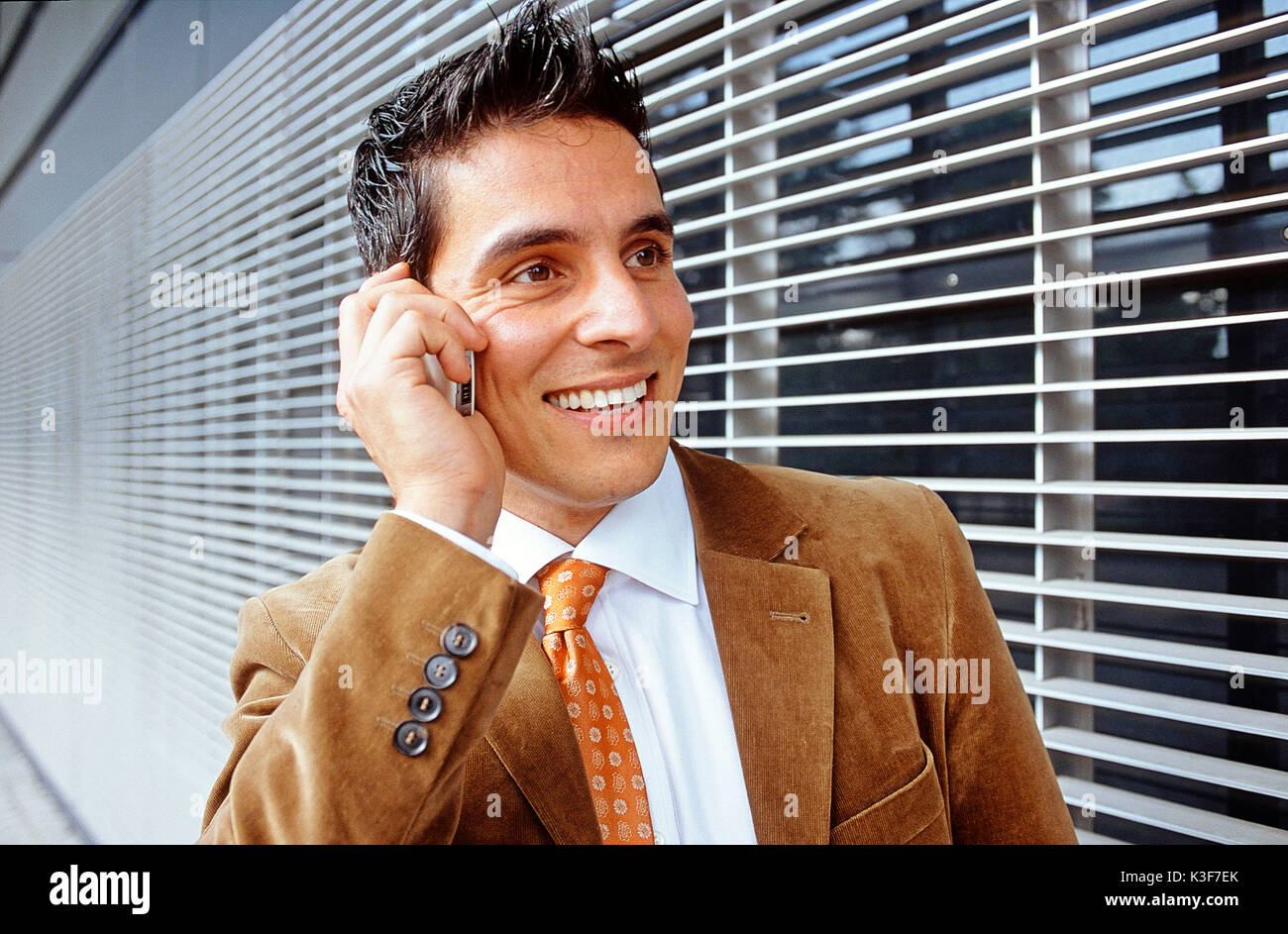 Young man phones outside mobile Stock Photo - Alamy