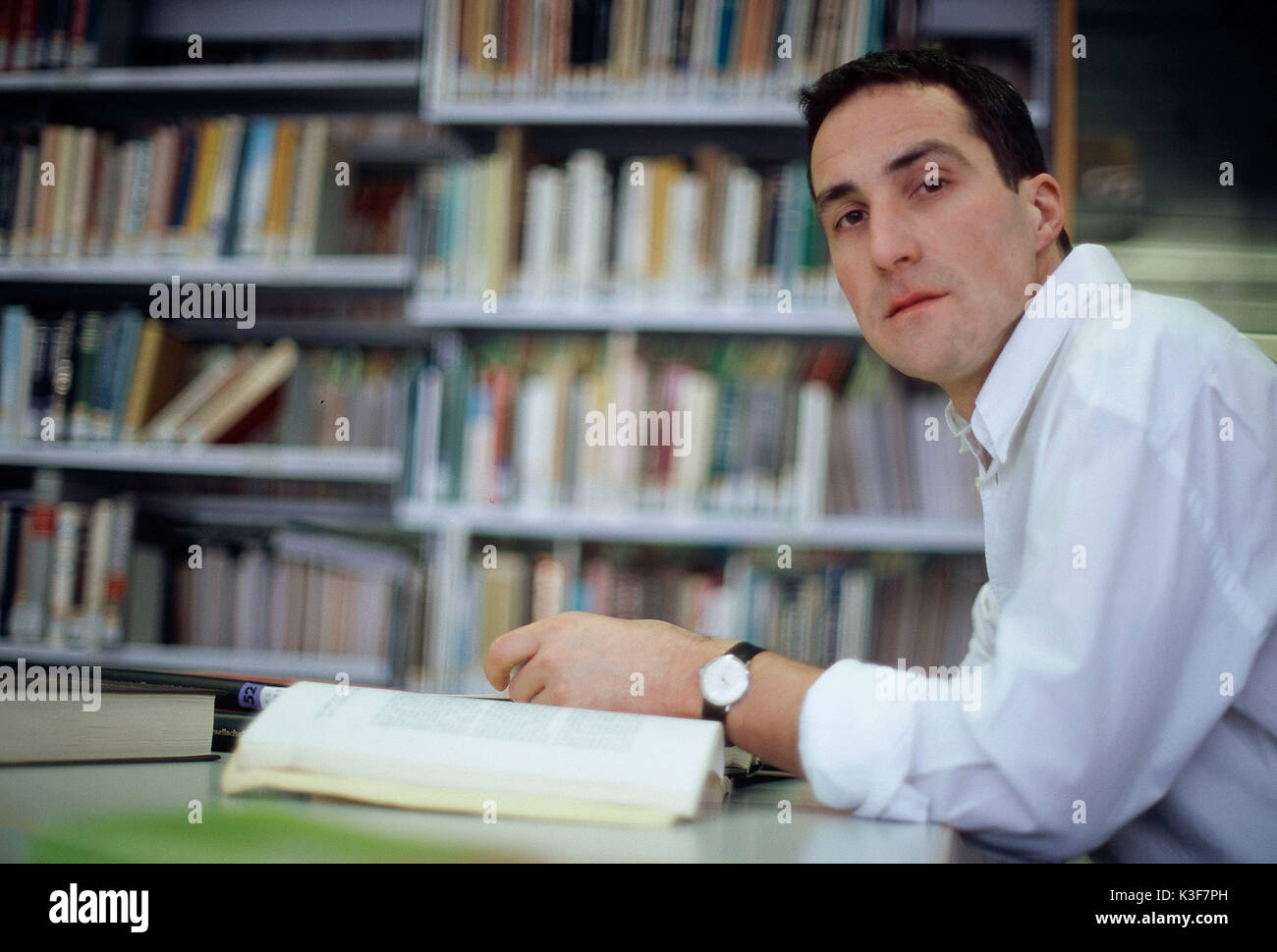 Man with book hi-res stock photography and images - Alamy