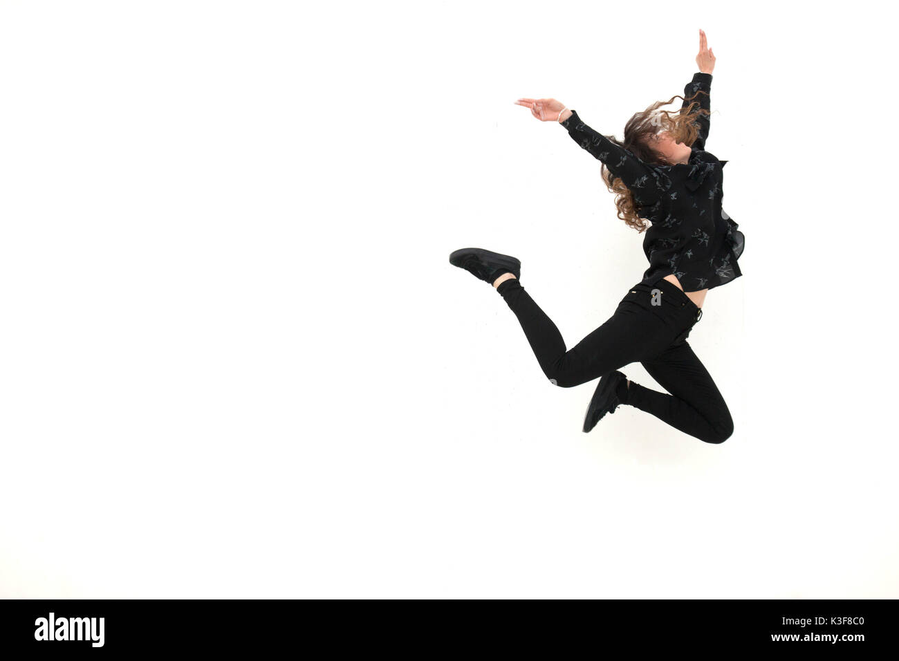 Leaping woman hi-res stock photography and images - Alamy