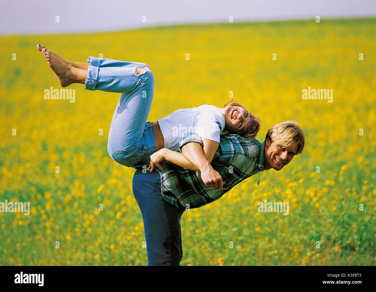 Man takes woman huckepack hi-res stock photography and images - Alamy