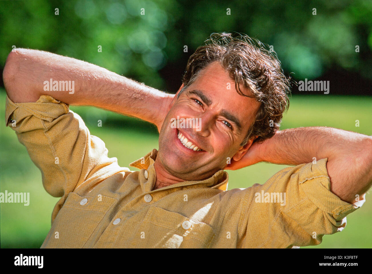 Arms behind her head hi-res stock photography and images - Alamy