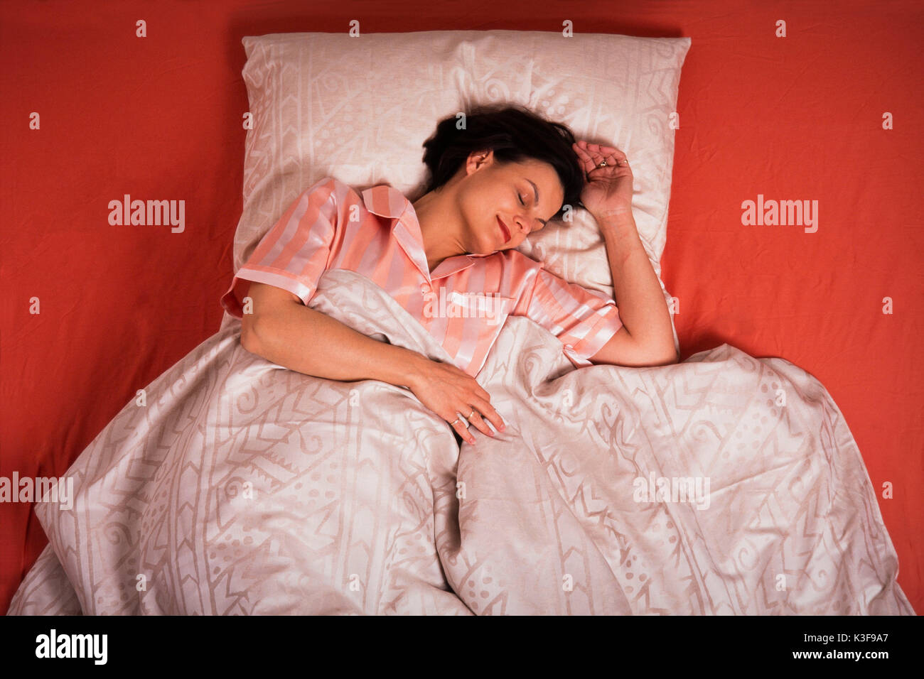Sleeping woman in the bed Stock Photo - Alamy