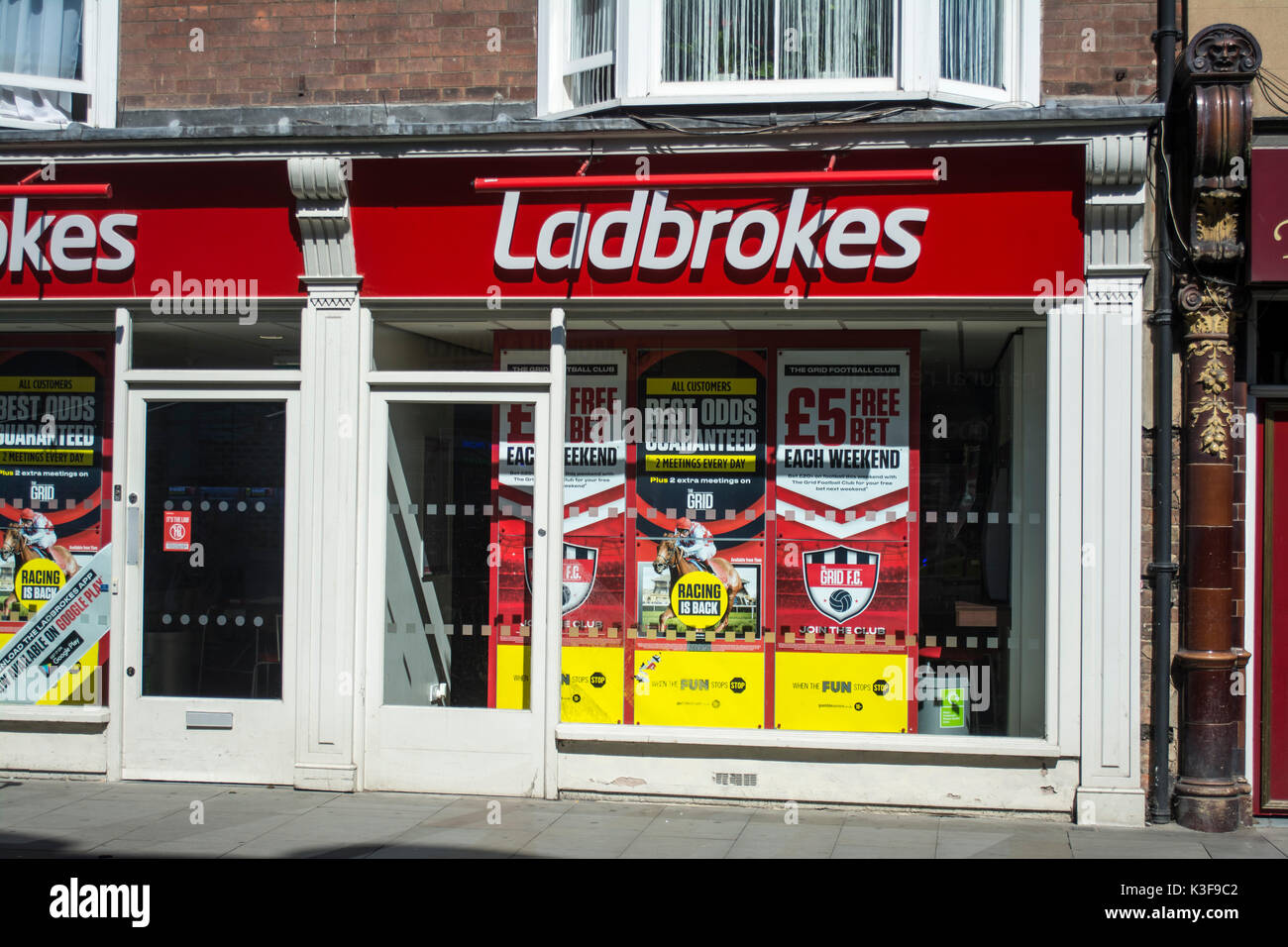 Shopfront of the Ladbrokes betting shop in Market Square Melton Mowbray ...
