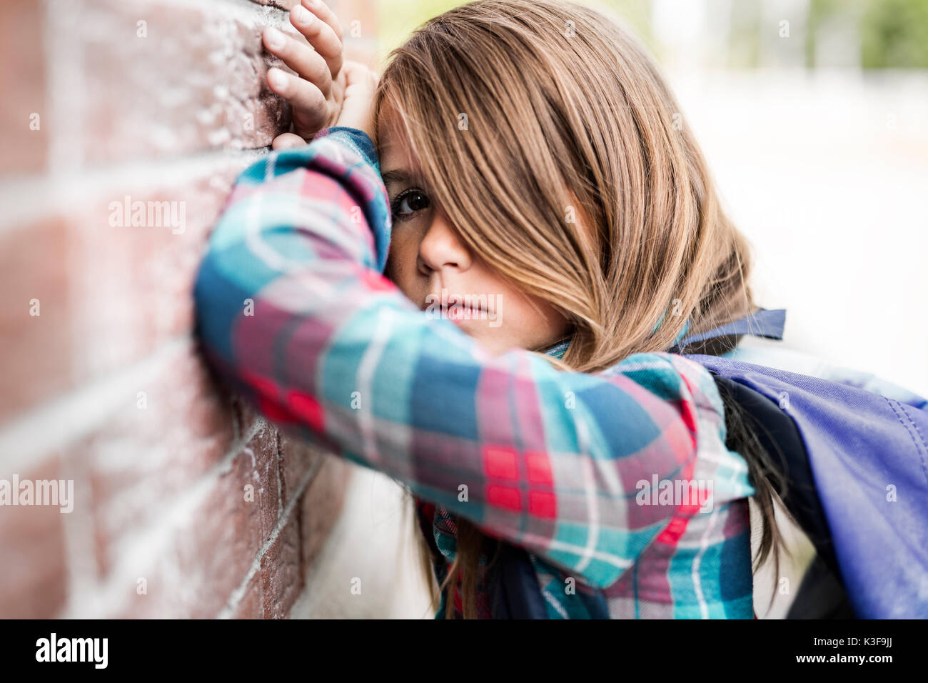 primary student depress at the school Stock Photo - Alamy
