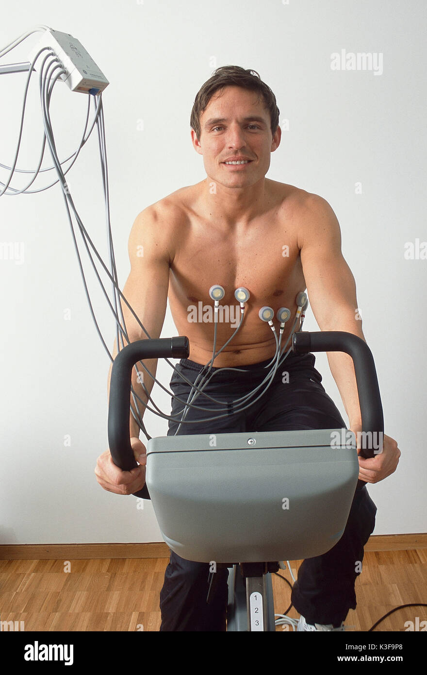 Young man at the charge ECG Stock Photo - Alamy