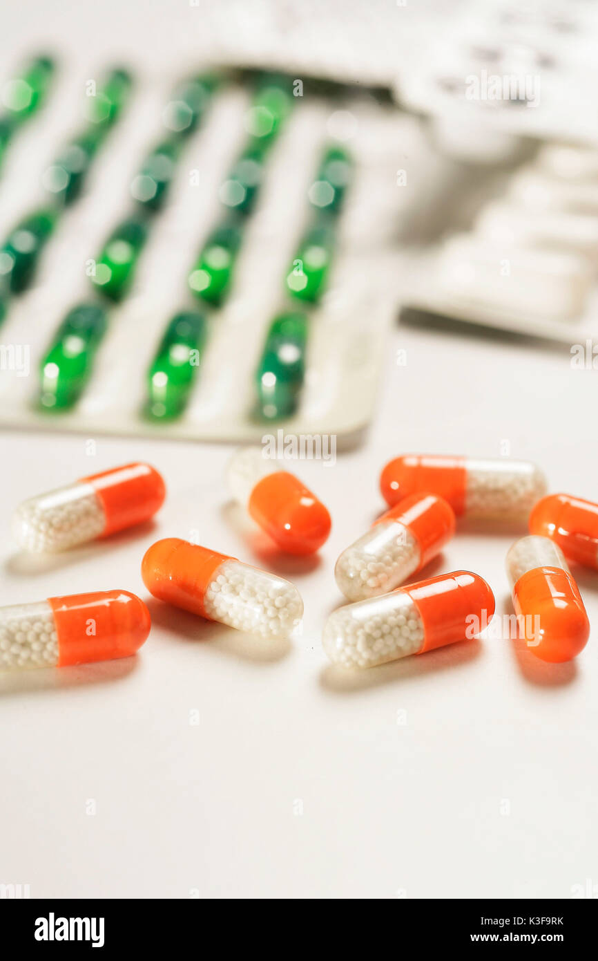 Orange capsules hi-res stock photography and images - Alamy