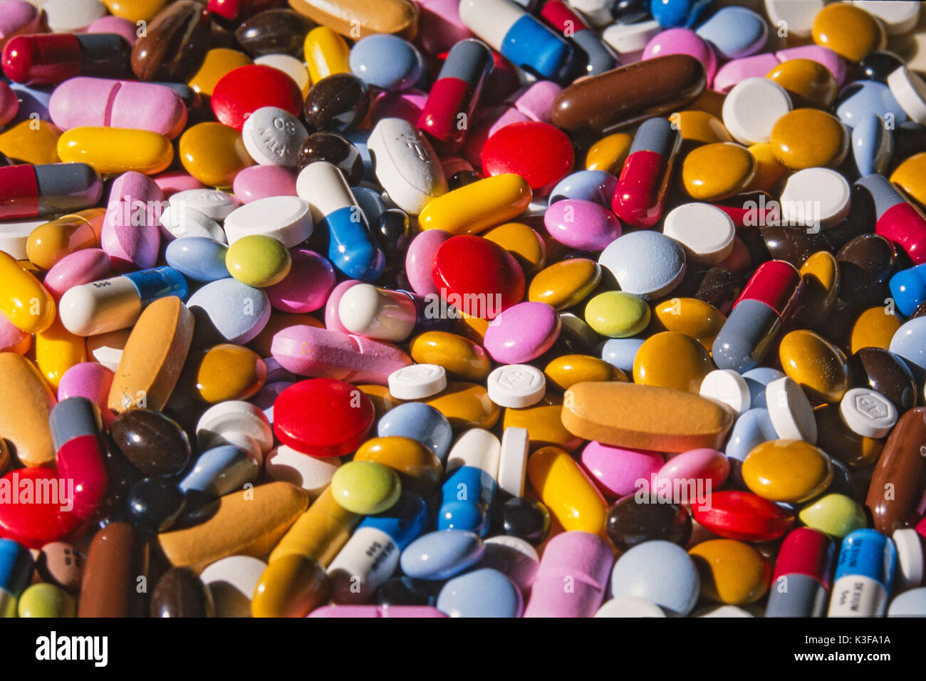 Coloured tablet mix Stock Photo - Alamy