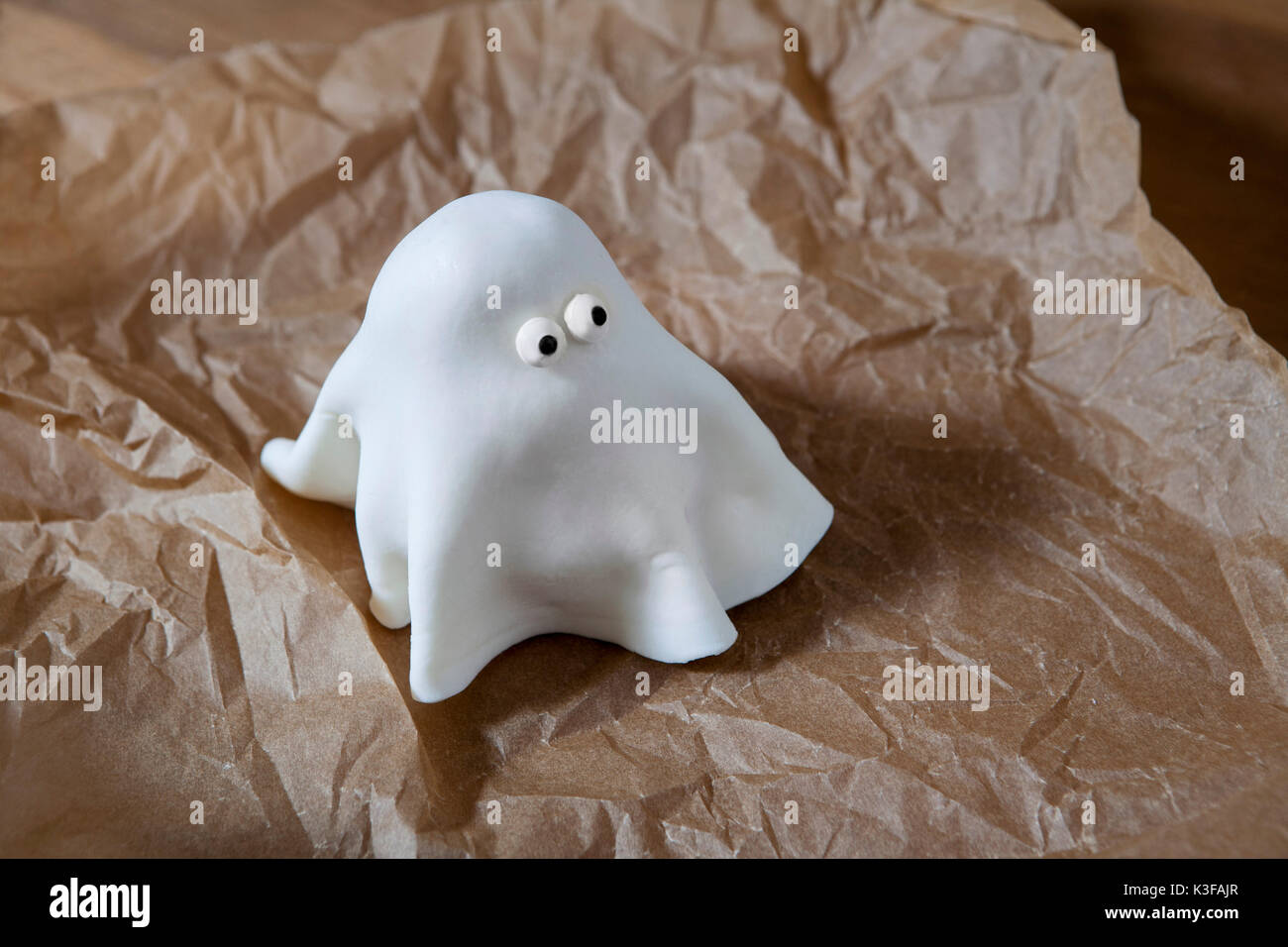 Ghost Cupcake with White Fondant Stock Photo - Alamy