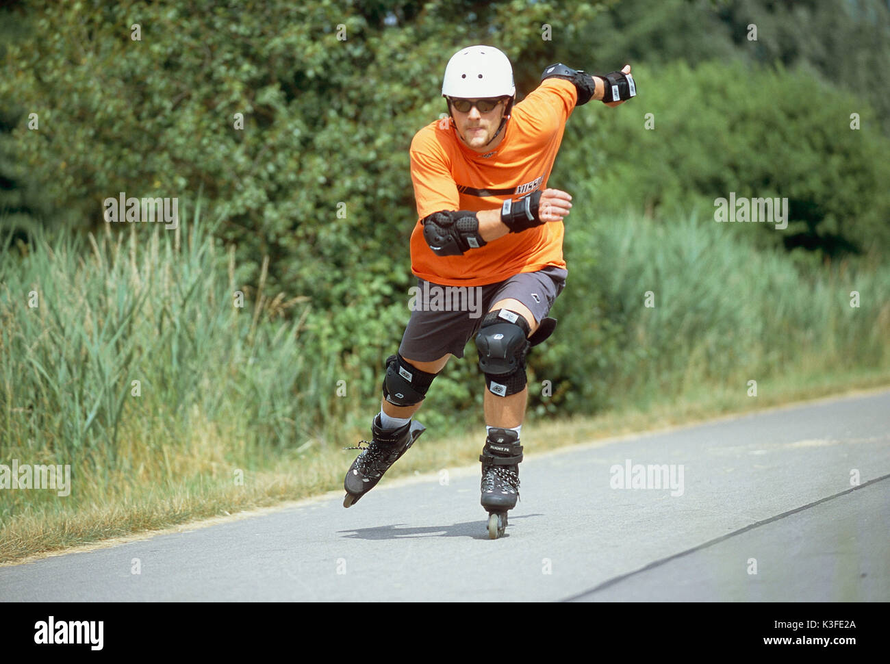 Young caucasian man roller skating hi-res stock photography and images ...