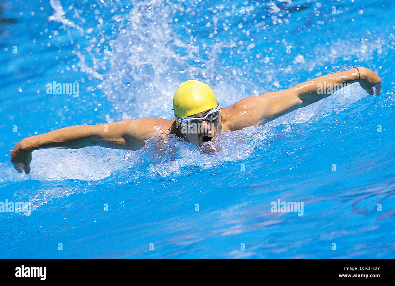 Swimmer in yellow swim cap hi-res stock photography and images - Alamy