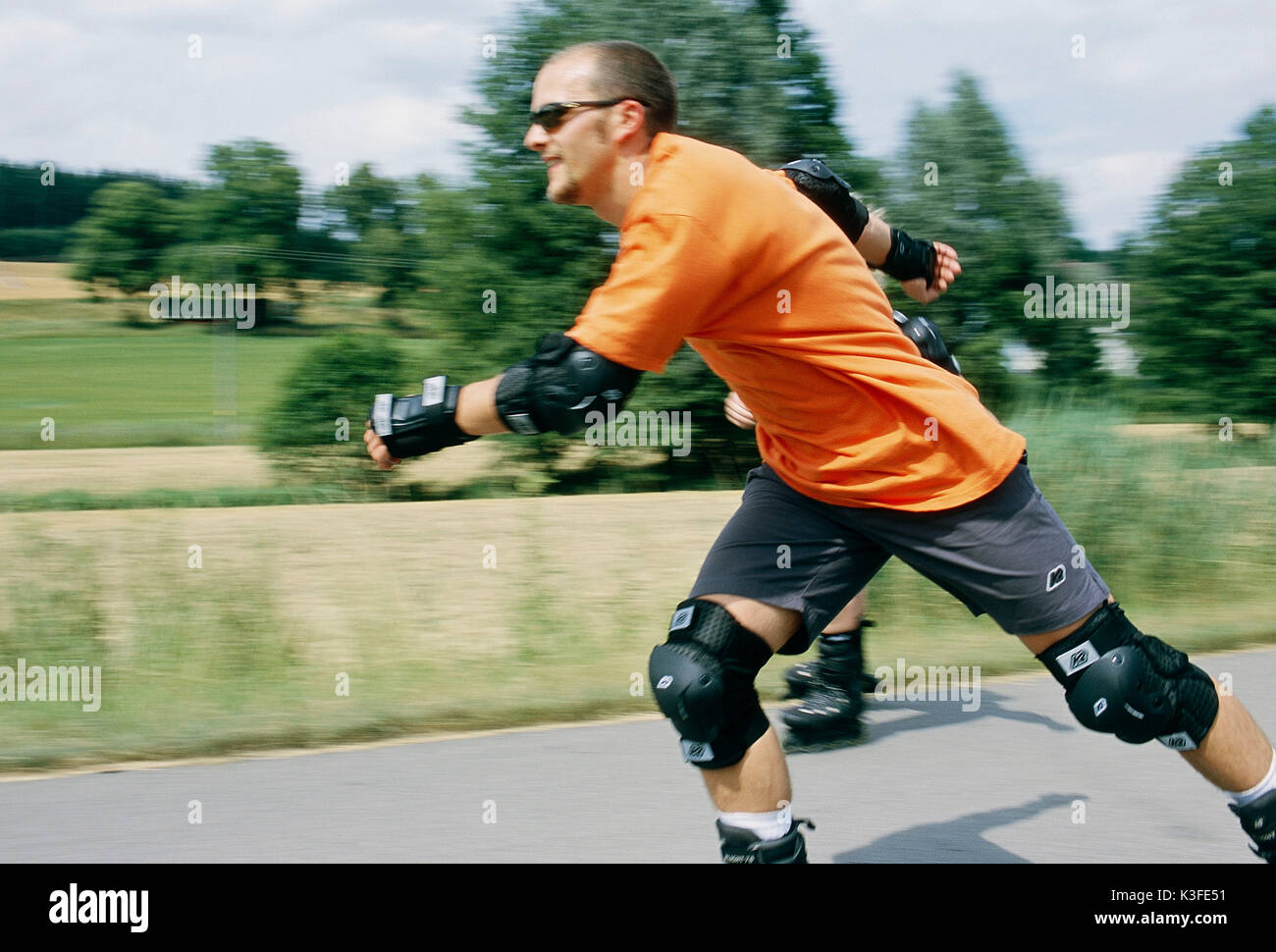 Young caucasian man roller skating hi-res stock photography and images ...