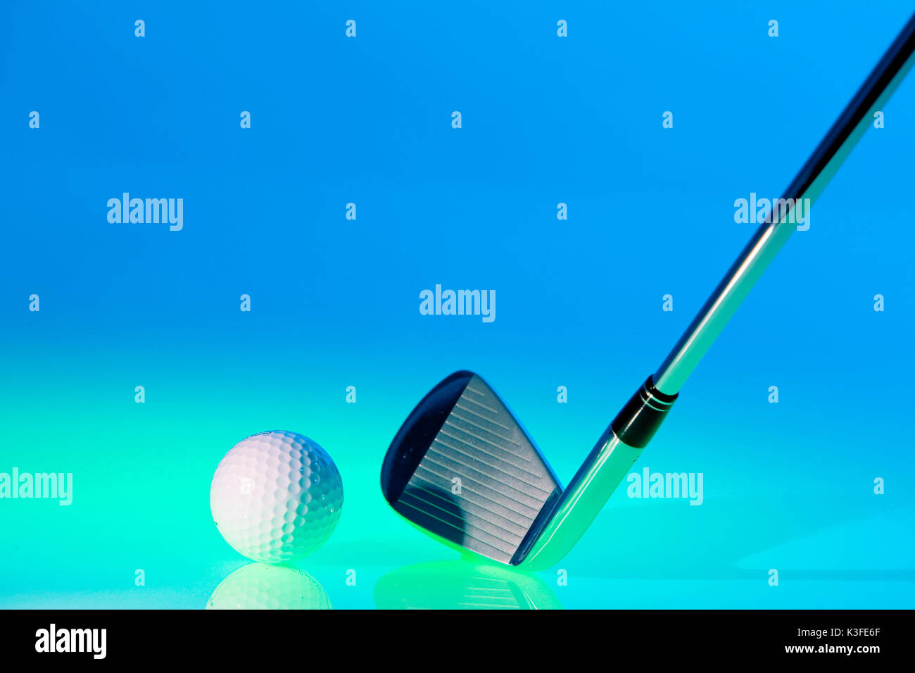 Golf ball and iron racquet Stock Photo - Alamy