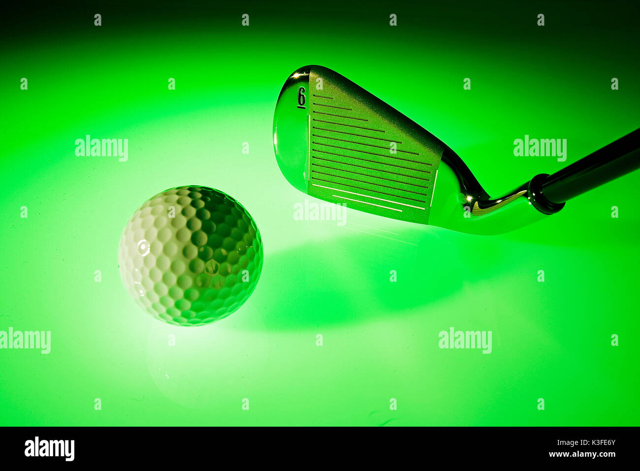 Golf ball and iron racquet Stock Photo - Alamy