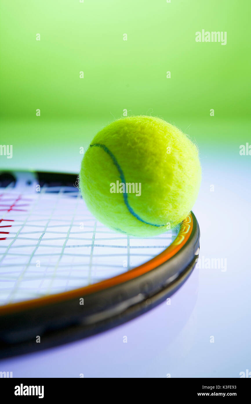 Tennis-ball and tennis racquet Stock Photo - Alamy