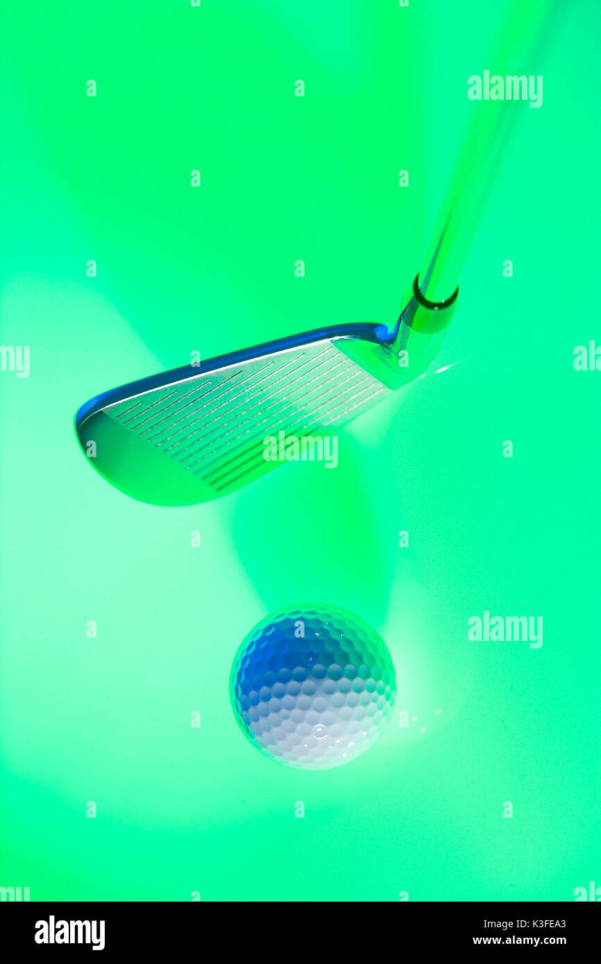 Golf ball and iron racquet Stock Photo - Alamy