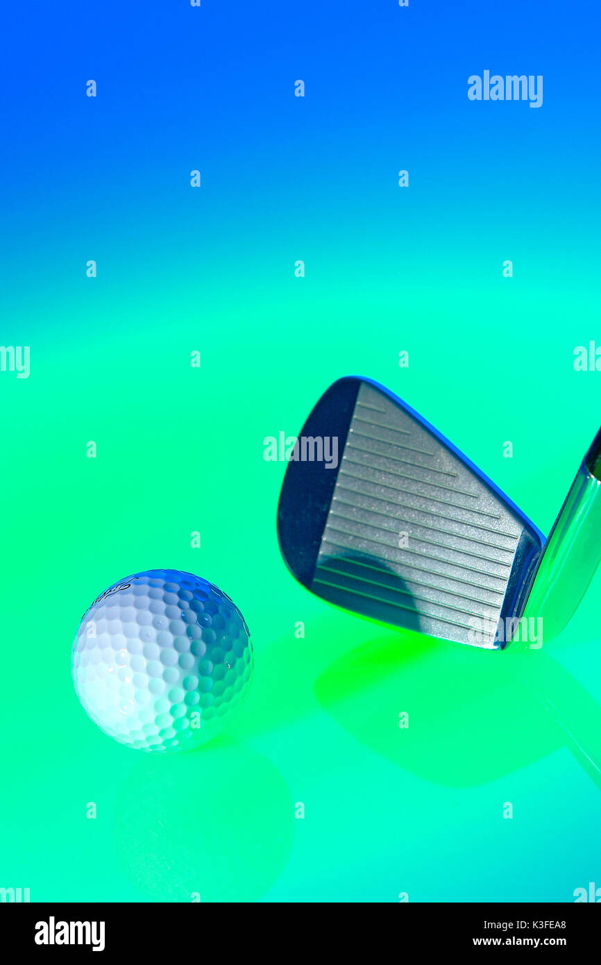 Golf ball and iron racquet Stock Photo - Alamy