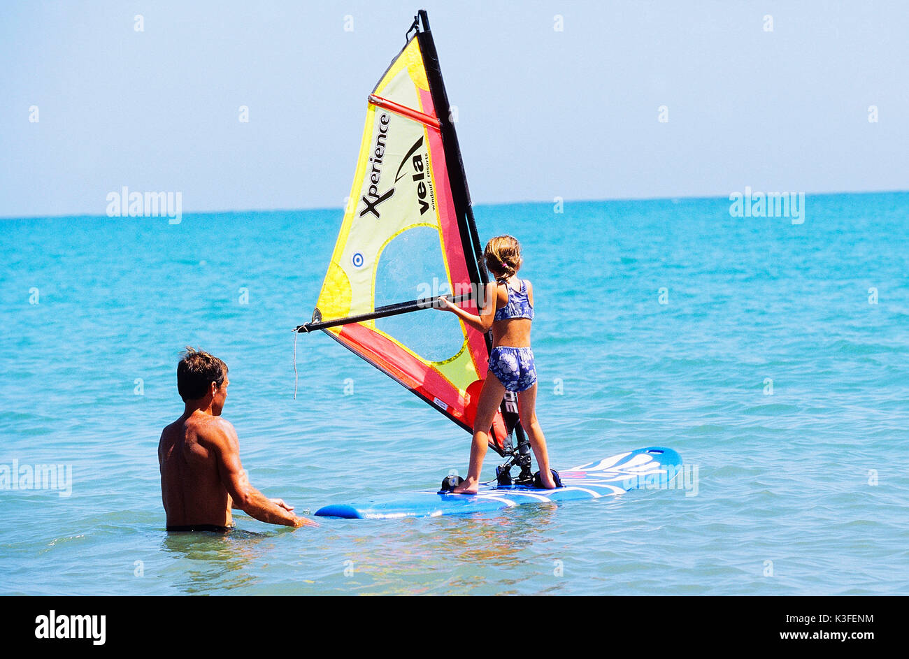 Father learns child windsurfing Stock Photo - Alamy