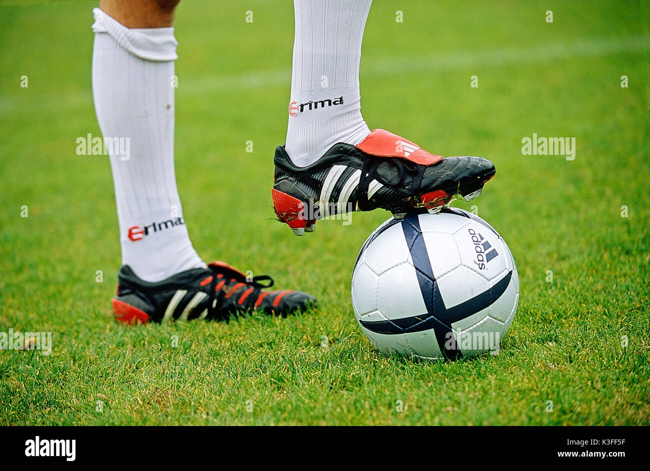 Footballer with ball Stock Photo - Alamy