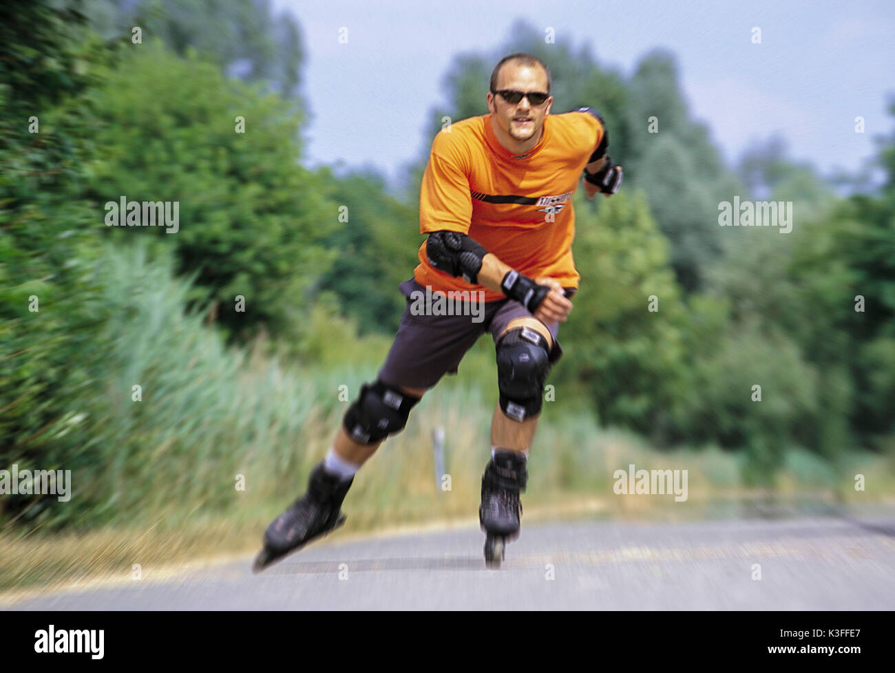Young caucasian man roller skating hi-res stock photography and images ...