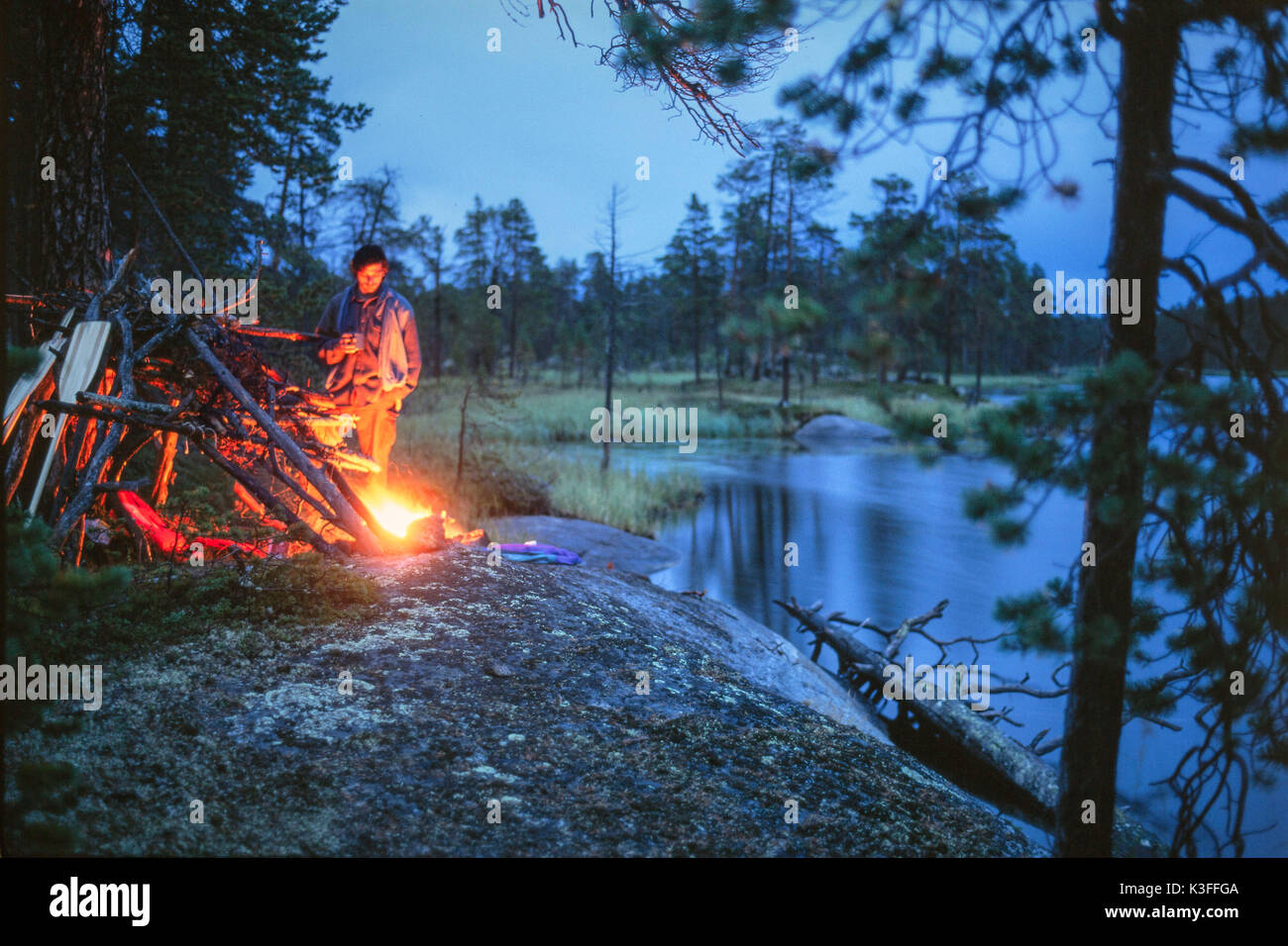 outdoor scenery with campfire at the lake Stock Photo - Alamy