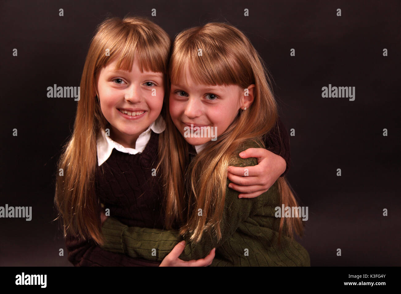 twin sisters hugging Stock Photo - Alamy