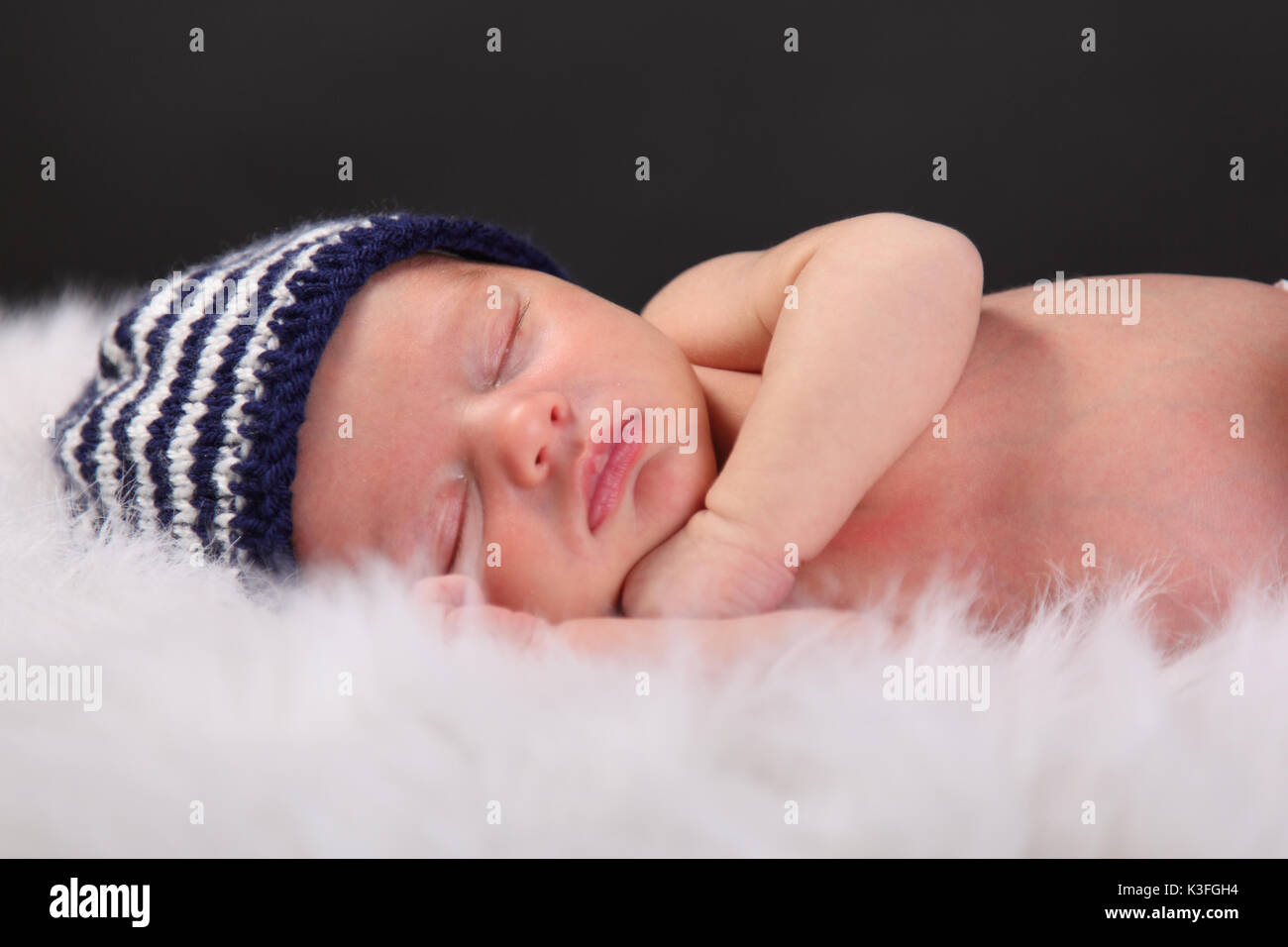 Child curled up blanket hi-res stock photography and images - Alamy