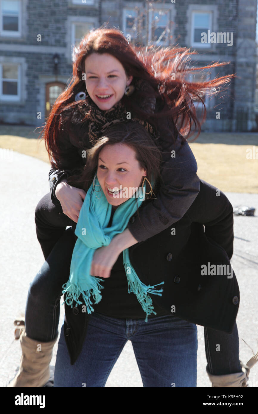girls piggy back Stock Photo - Alamy