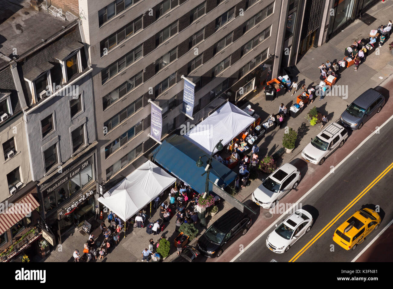 Long Line of Students Checking into Midtown Manhattan Dormitory for ...