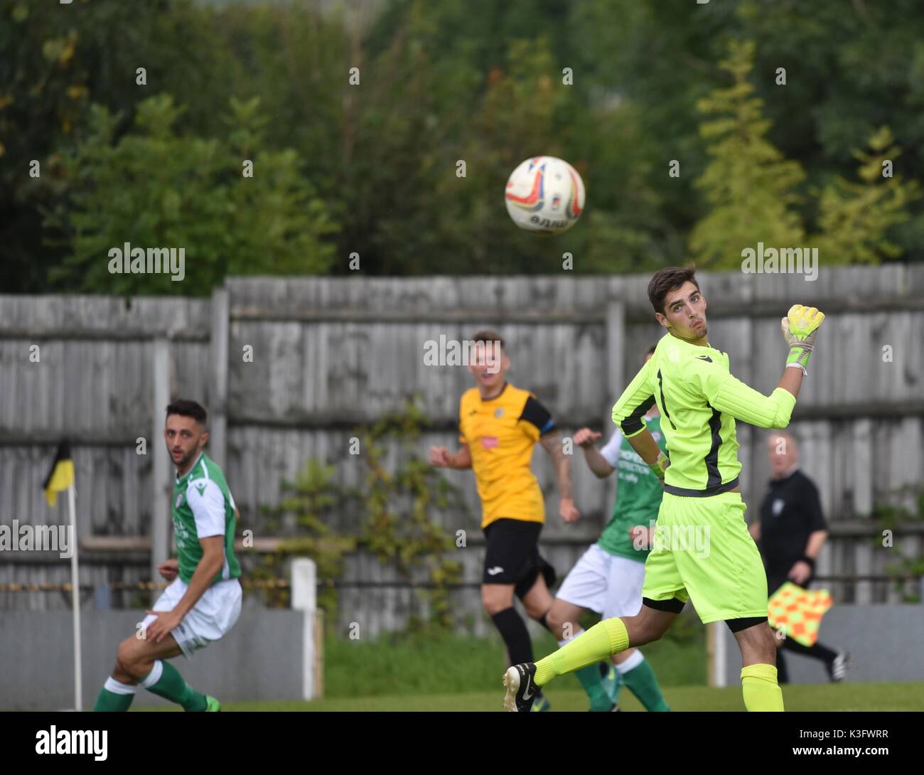 Football action from the non-league match between New Mills and Holker ...