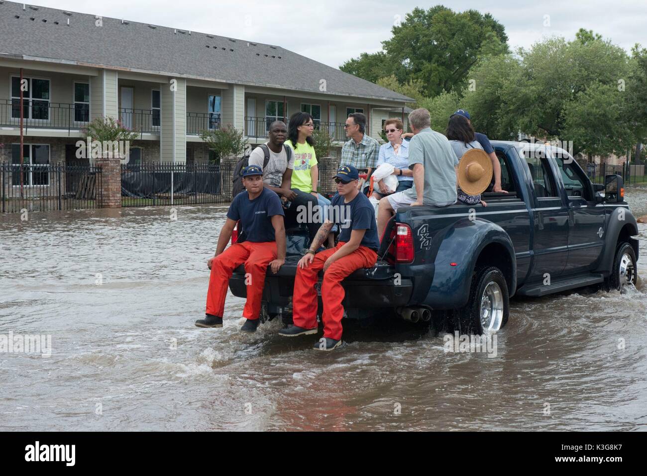 U.S. Coast Guard teams evacuate stranded residents trapped by flood ...