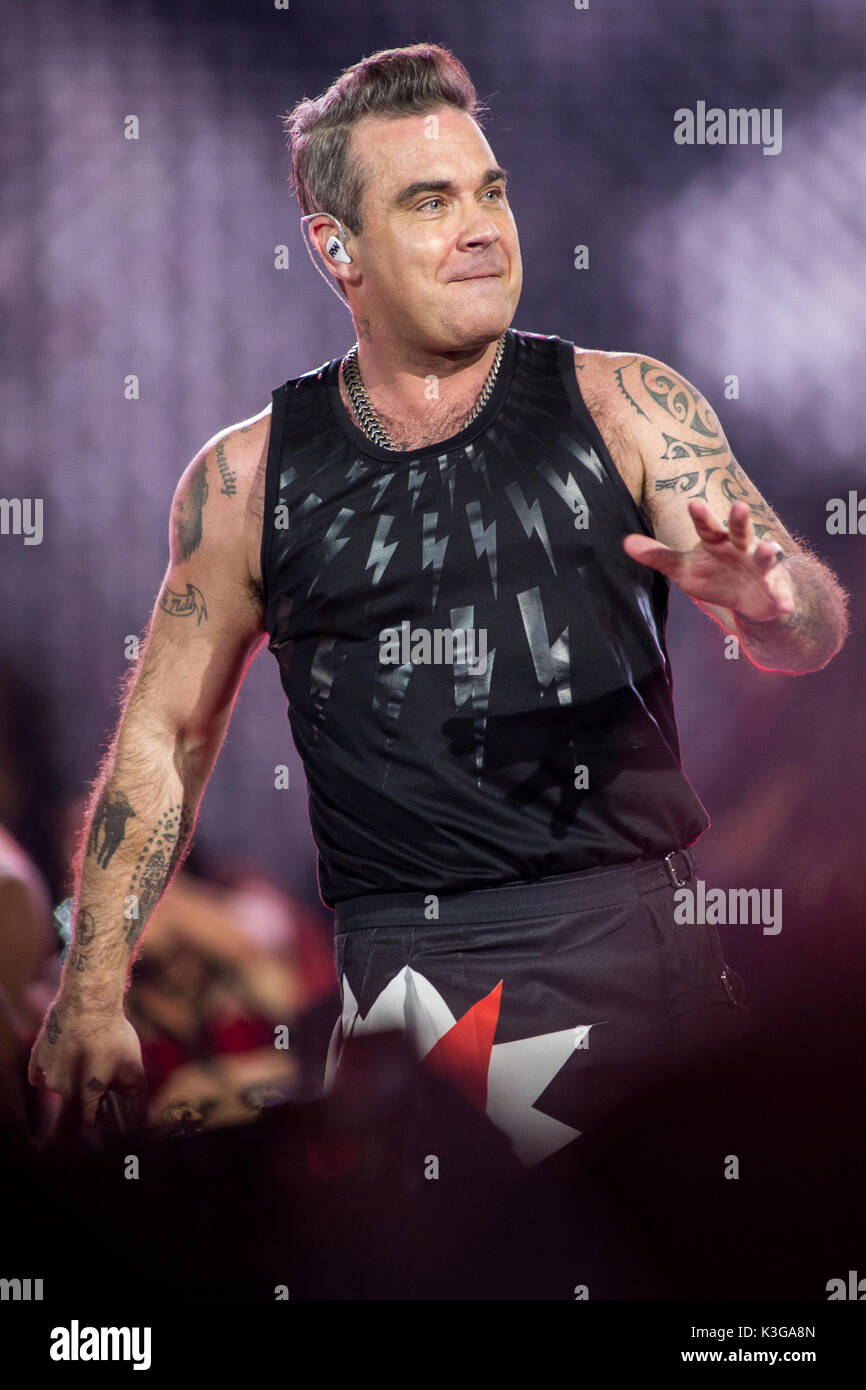 Robbie williams performs live on stage hi-res stock photography and ...