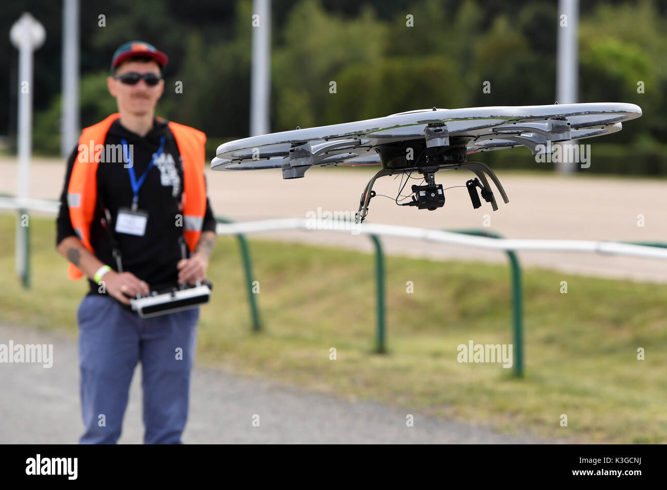 A drone pilot at the "Dronemasters Dronathon" steers his multicopter ...