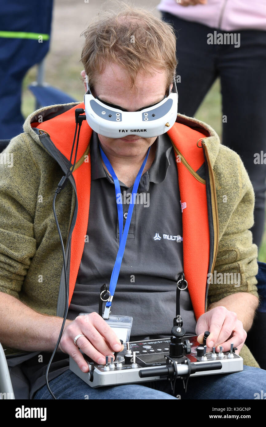 A drone pilot at the "Dronemasters Dronathon" steers his multicopter ...