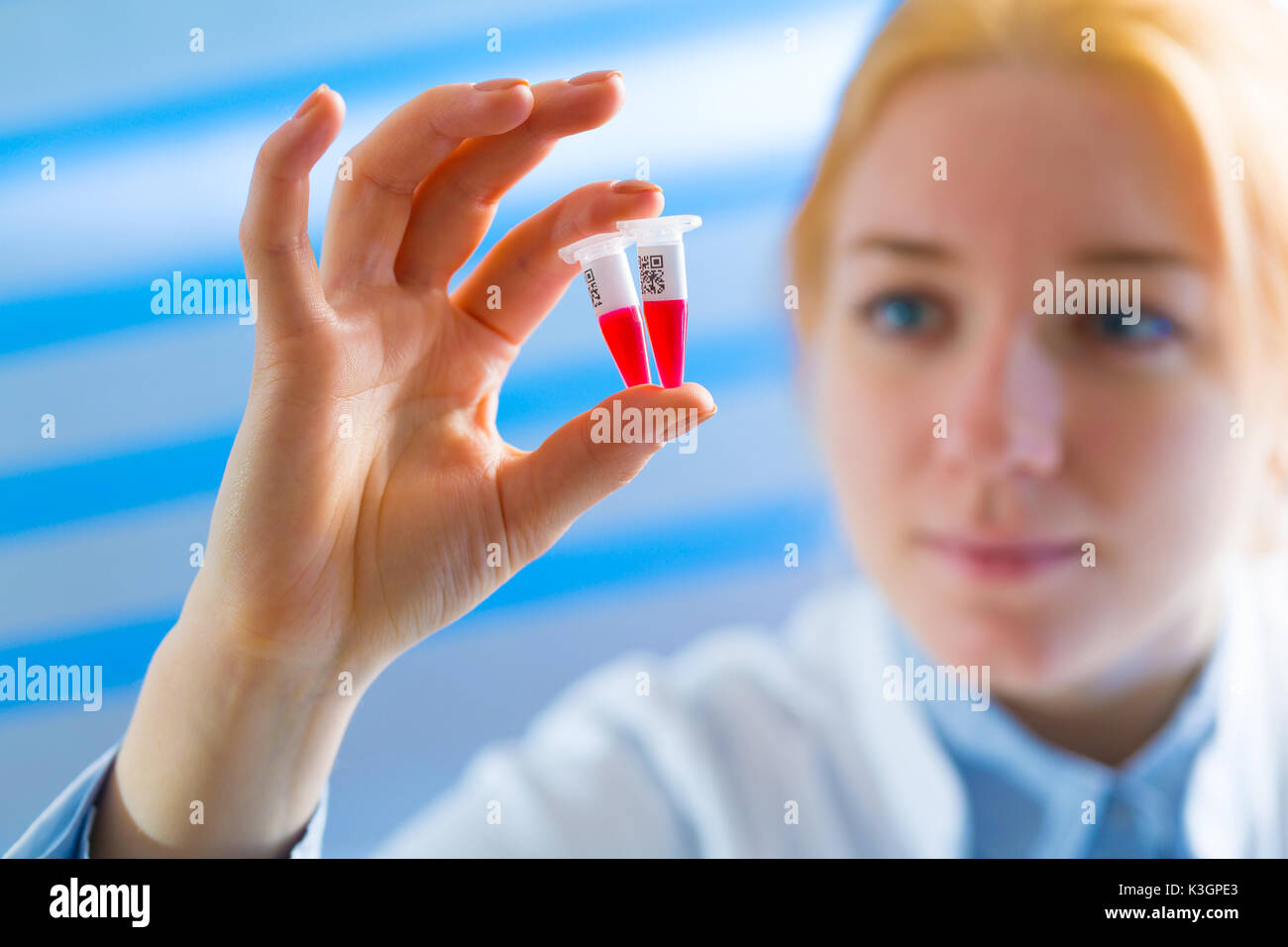 Student with test tube Stock Photo - Alamy