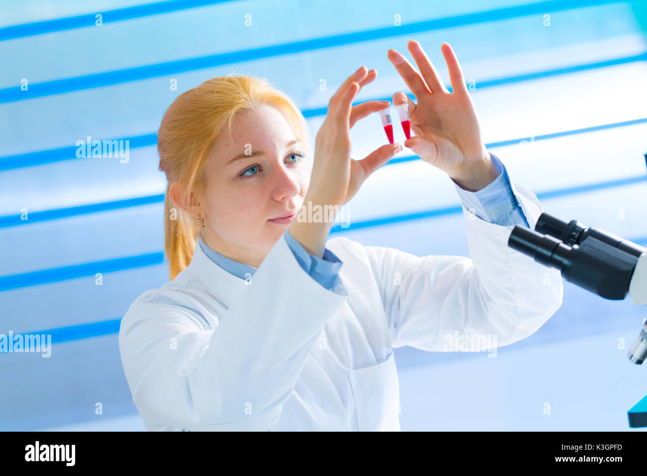 Student with test tube Stock Photo - Alamy