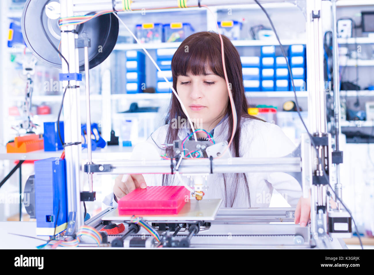 A female student or laboratory assistant in the automation laboratory ...