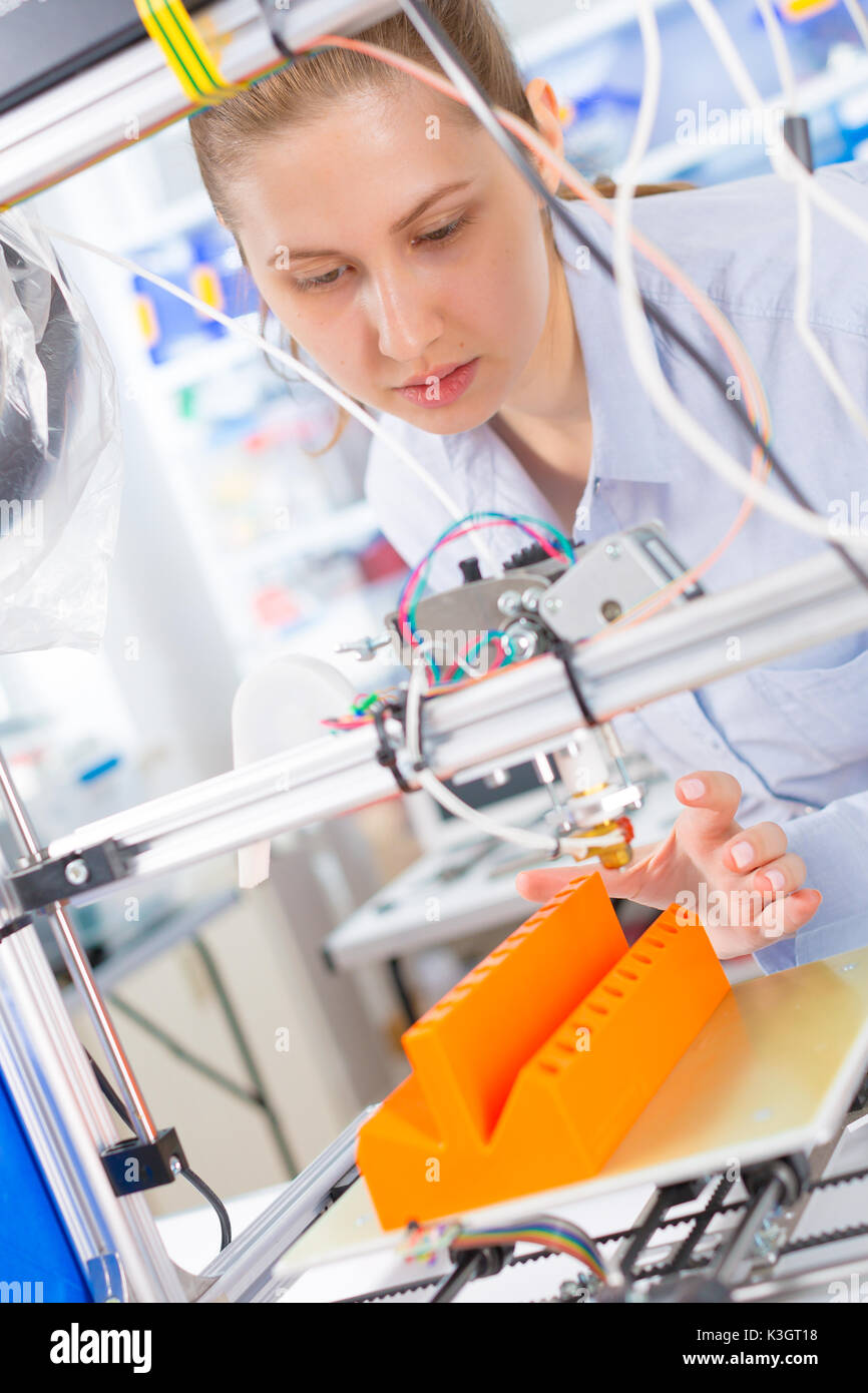 A female student or laboratory assistant in the automation laboratory ...