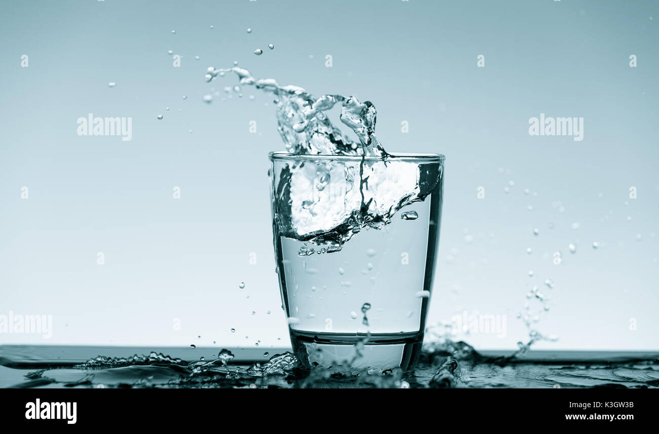 Water splash in glass. Drinking water concept Stock Photo - Alamy