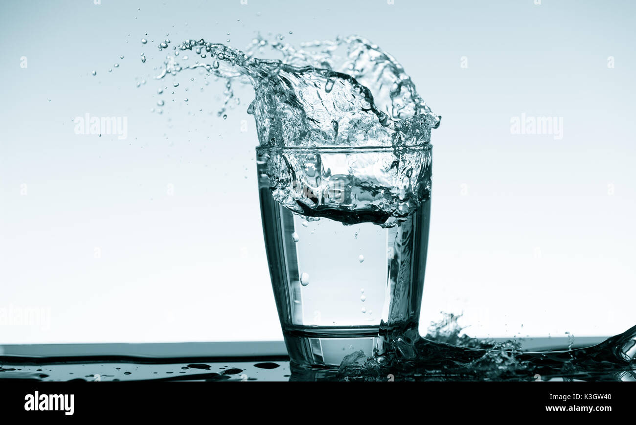 Water splash in glass. Drinking water concept Stock Photo - Alamy