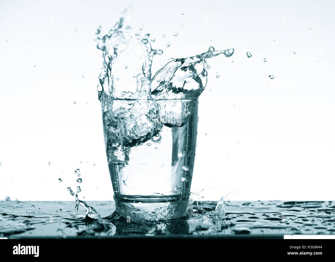 Water splash in glass. Drinking water concept Stock Photo - Alamy
