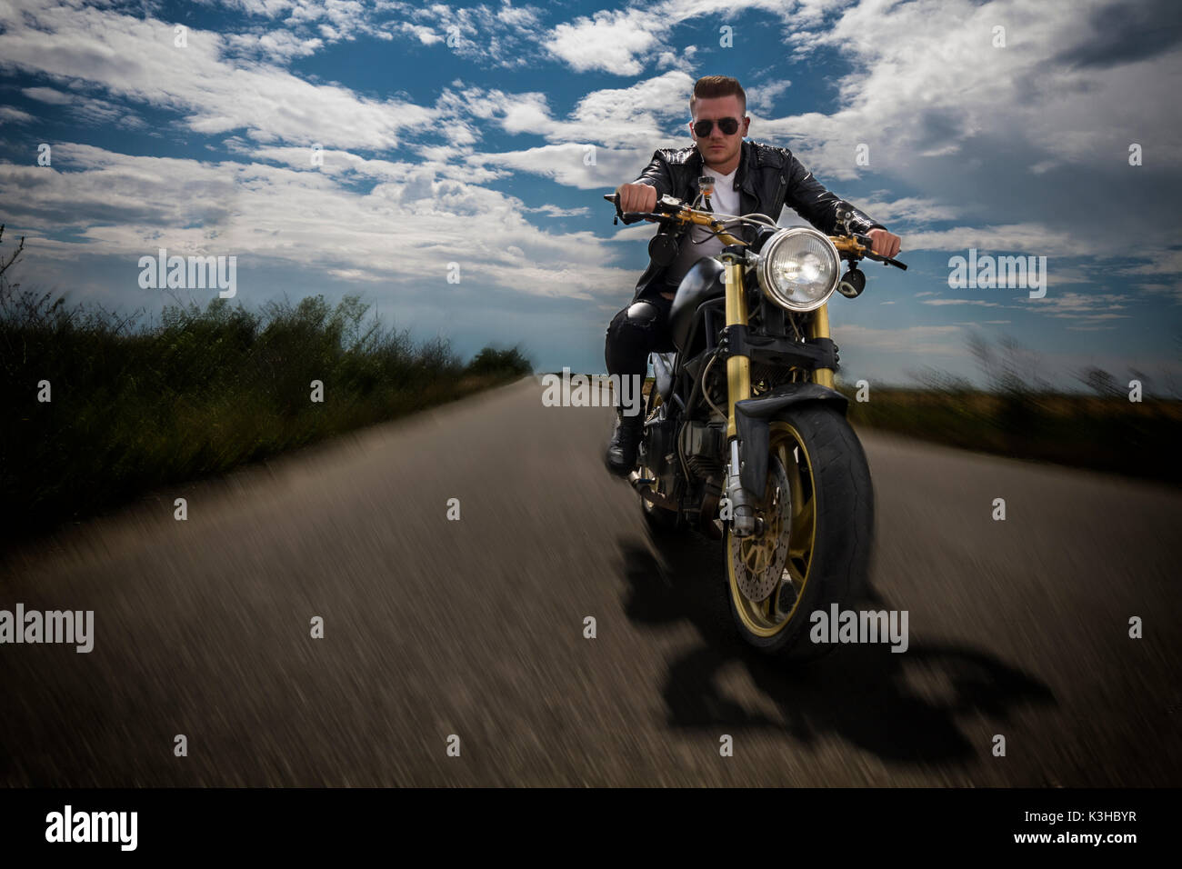 Driving Motorcycle on Asphalt Road Moving Action Stock Photo - Alamy