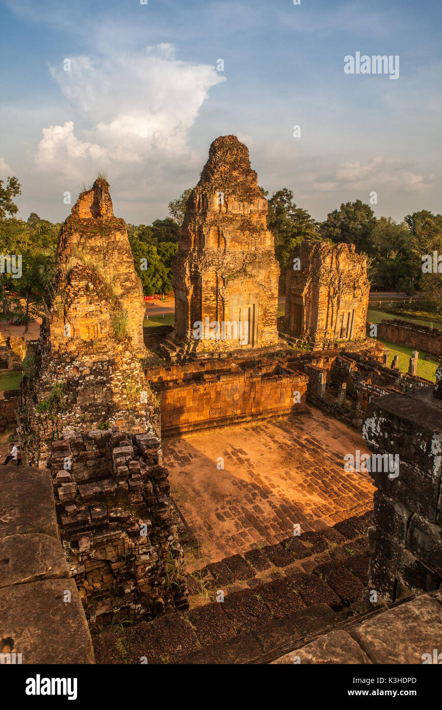 Red sandstone outer towers at Pre Rup temple complex at Angkor glow at ...