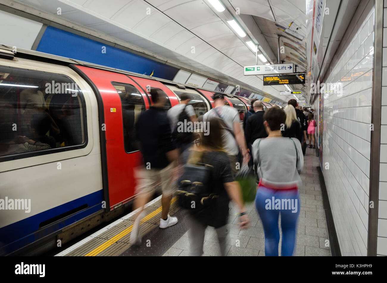 Passengers hurry down the platform at Tottemham Court Road subway ...
