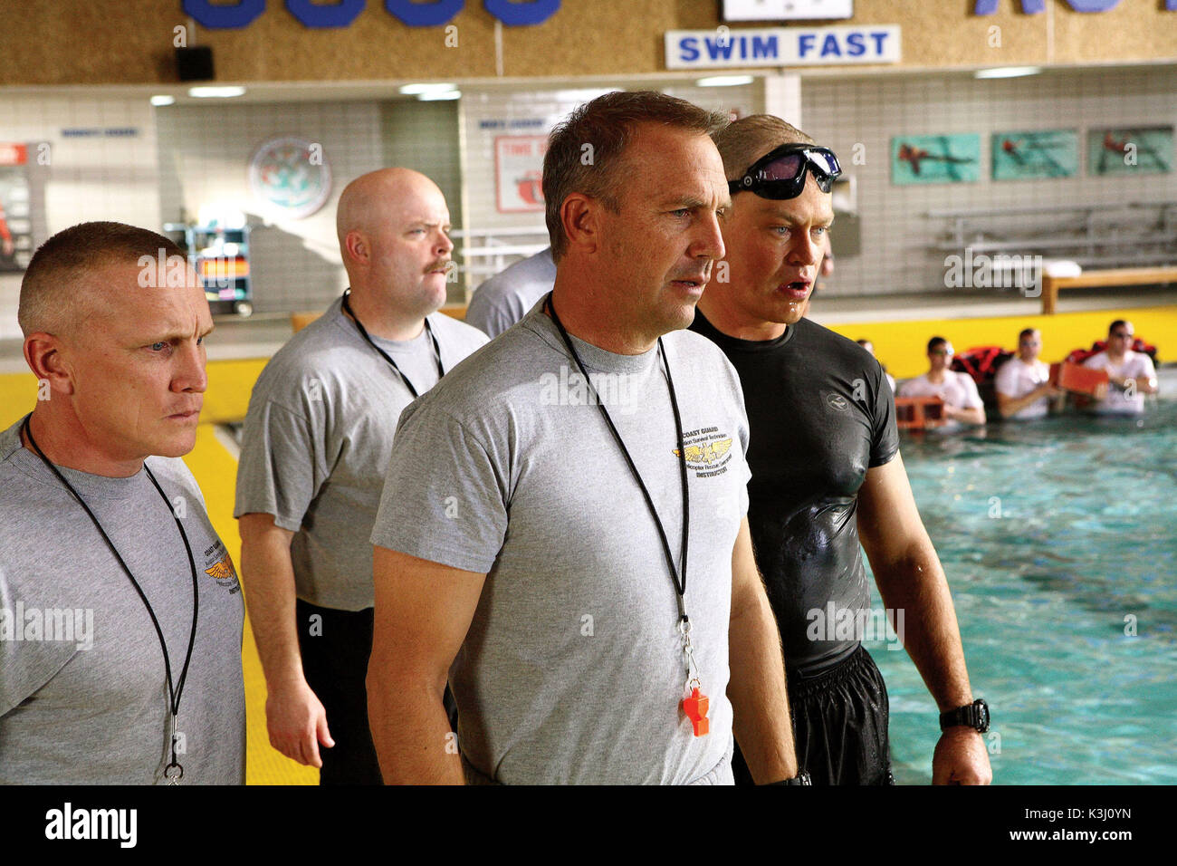 Coast Guard instructors Ben Randall (KEVIN COSTNER, center), and ...