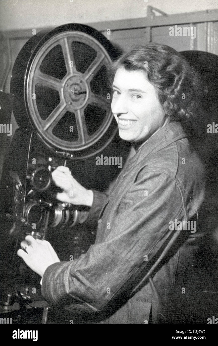 FEMALE PROJECTIONIST LACING UP A FILM DURING WORLD WAR 2 Stock Photo ...