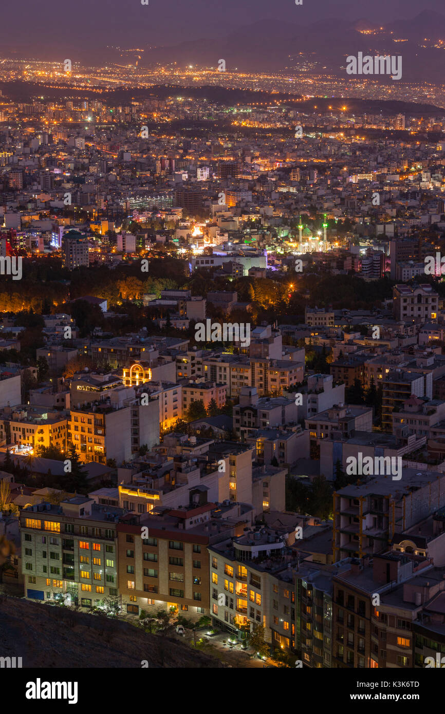 Iran, Tehran, elevated city skyline from the Roof of Iran Park, dusk ...