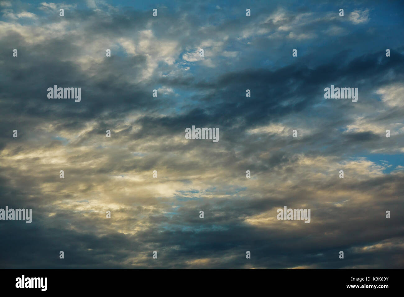 Yellow blue sunset sky with sunlight sky sunset Stock Photo - Alamy
