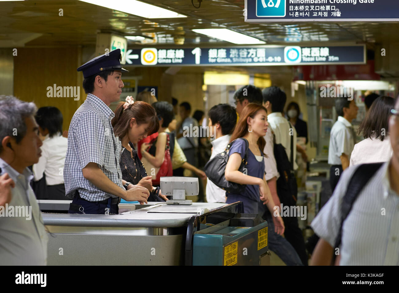 Ticket inspector in the Tokyo subway Stock Photo - Alamy
