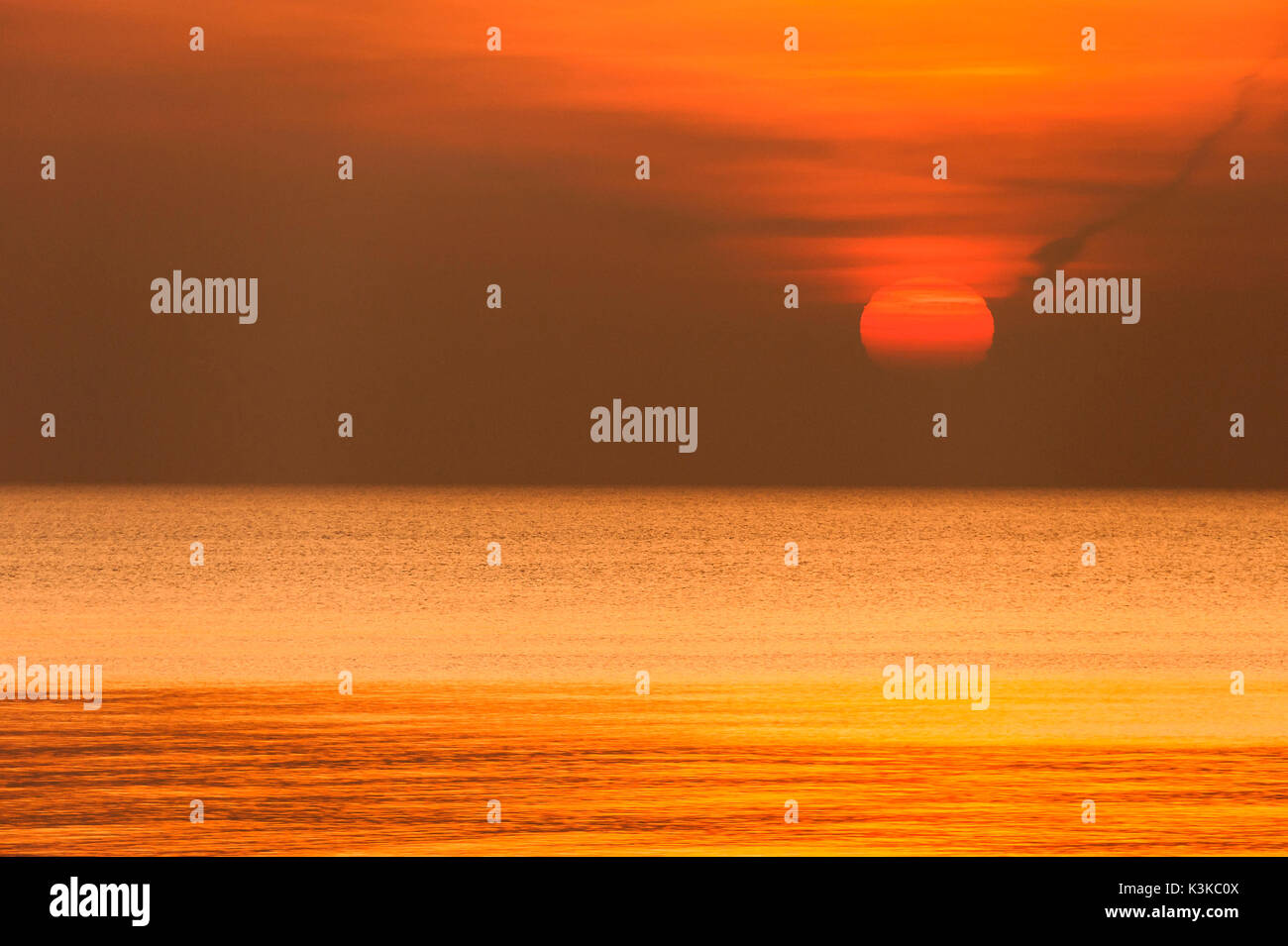 Red sundown by the sea Stock Photo - Alamy